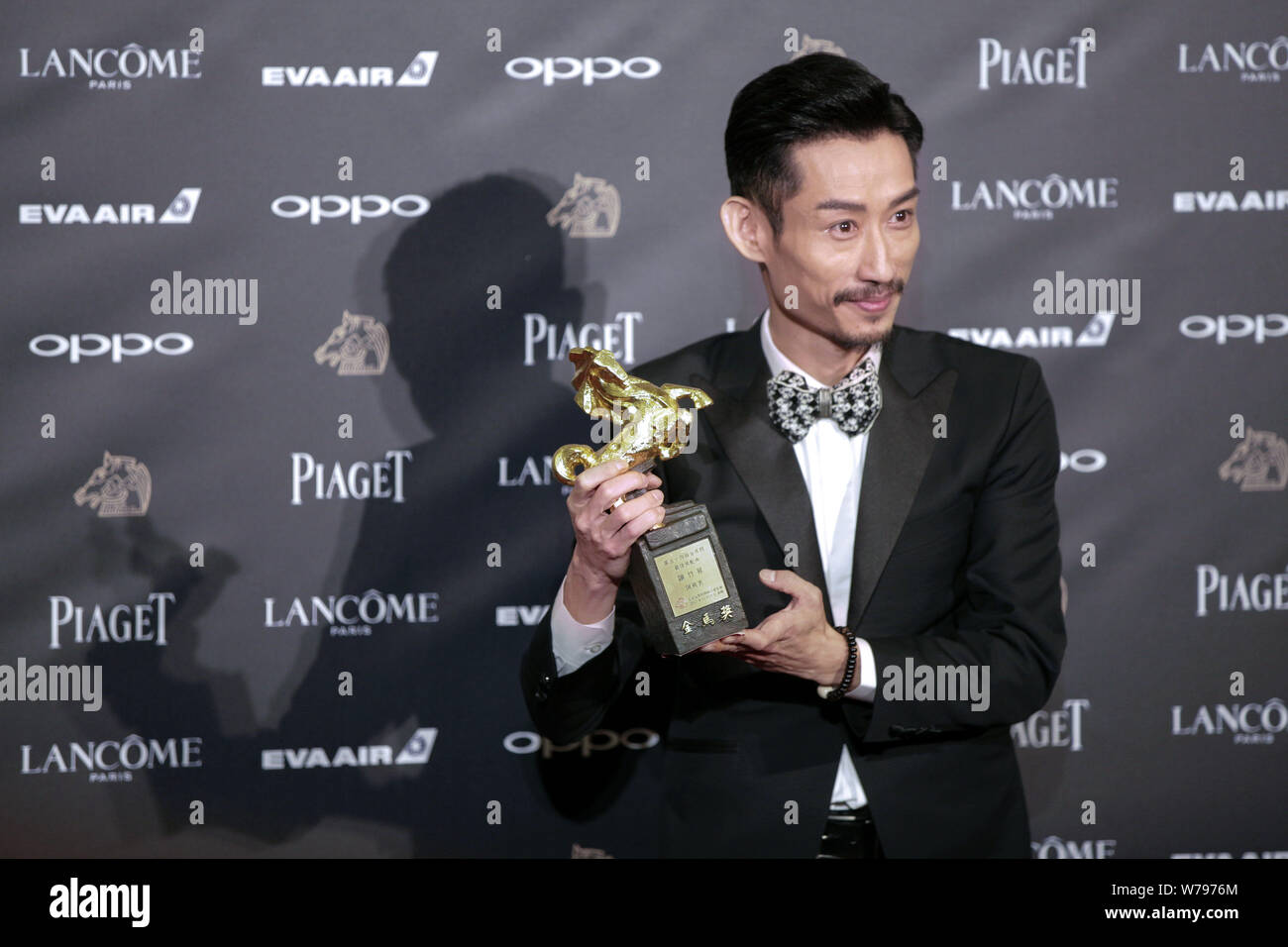 Taiwanese actor Chen Chu-sheng poses with his trophy of the Best ...