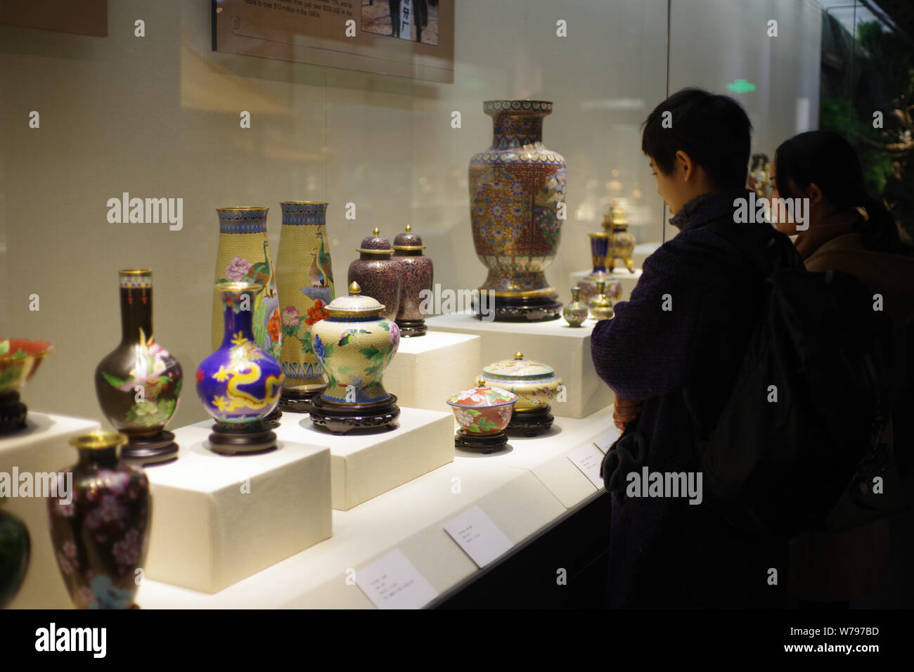 Visitors enjoy the cloisonne artworks in the biggest cloisonne factory ...