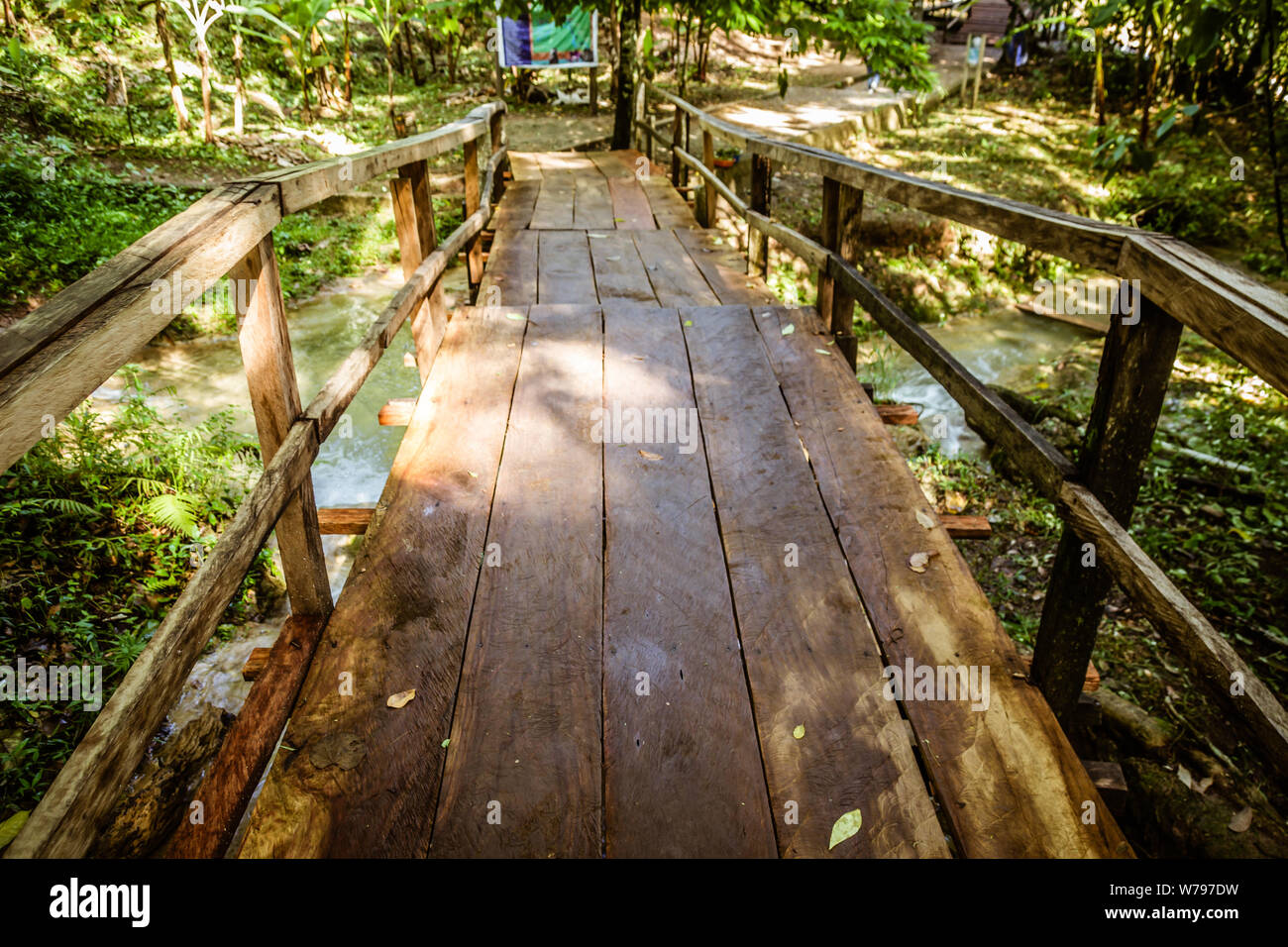 Photograph of a wooden bridge in a forest Stock Photo - Alamy