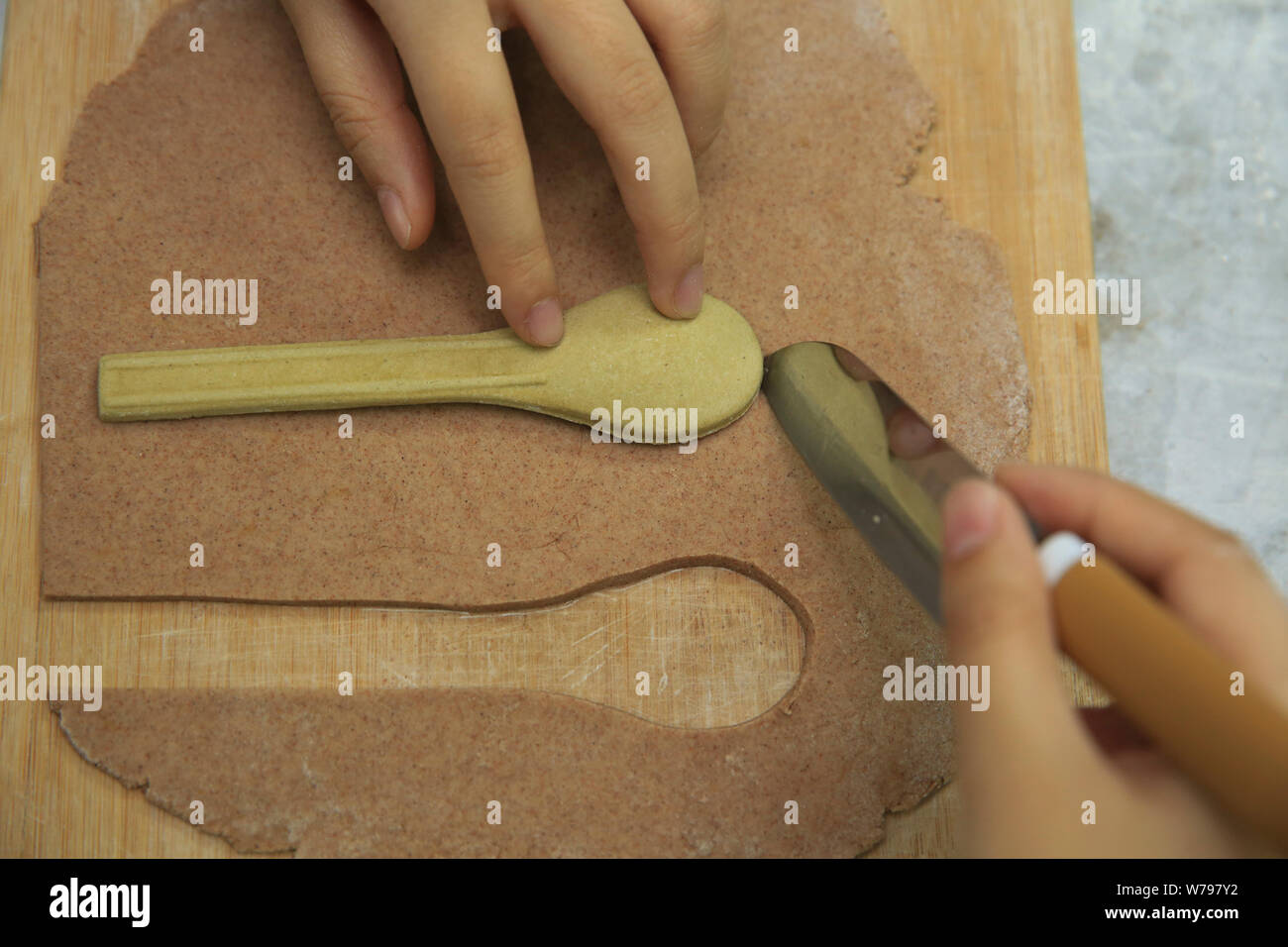 A junior student creates edible chopsticks and scoops made of flour at ...
