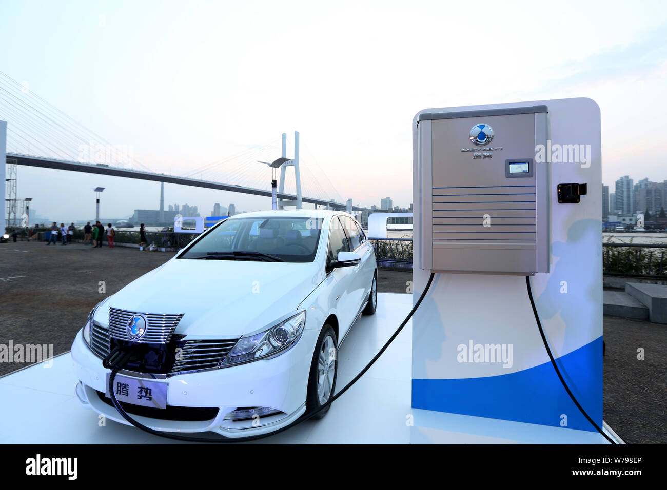 --FILE--A Denza electric vehicle (EV) is being recharged in front of a ...