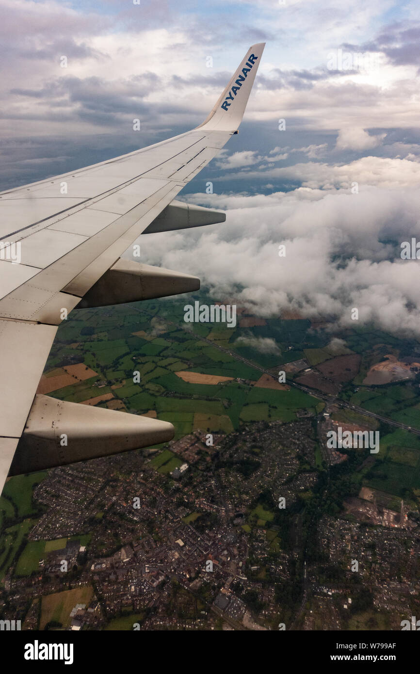 Wing on a Ryanair Boeing 737 - 800 entering british airspace on route ...