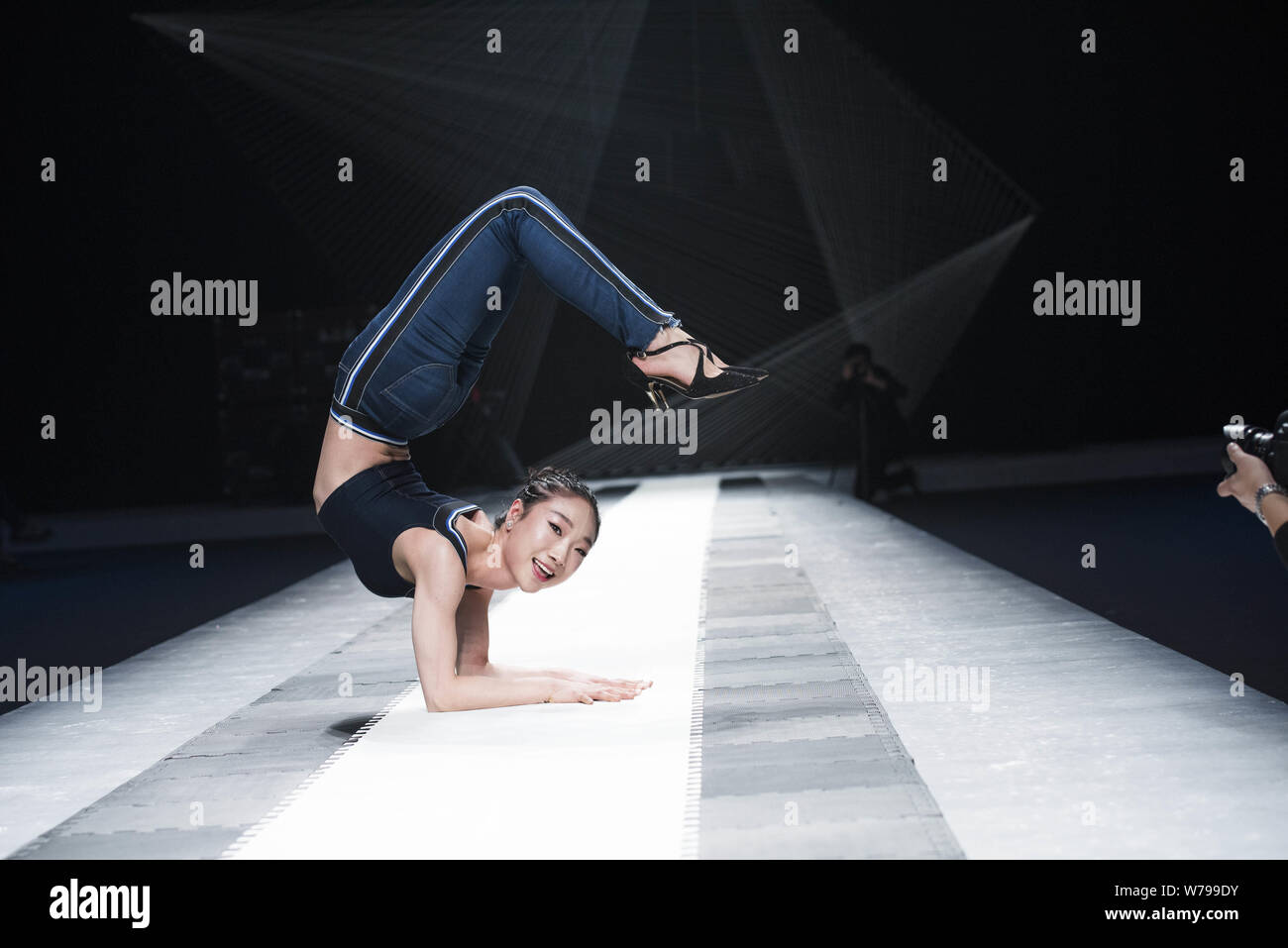 Chinese contortionist Liu Teng performs during an attempt to set a new ...