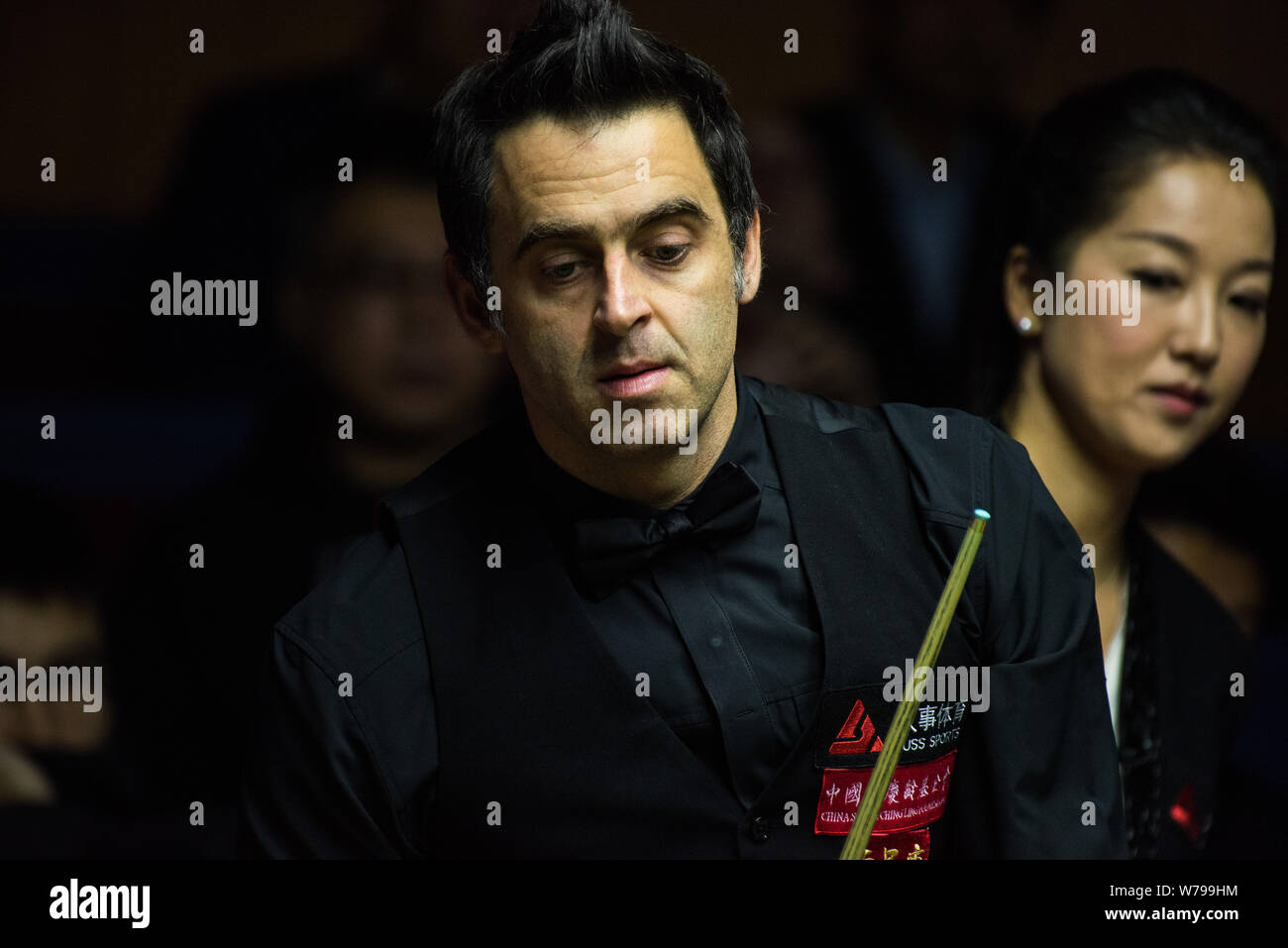 Ronnie O'Sullivan of England considers a shot to Joe Perry of England ...