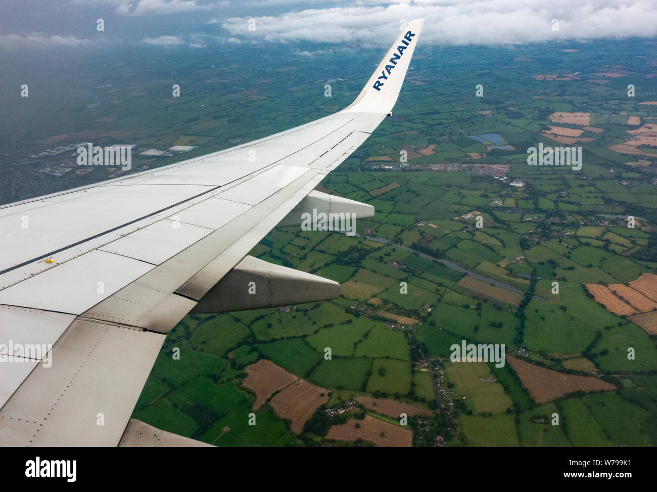 Wing on a Ryanair Boeing 737 - 800 entering british airspace on route ...