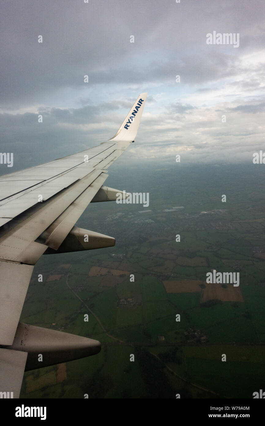 Wing on a Ryanair Boeing 737 - 800 entering british airspace on route ...