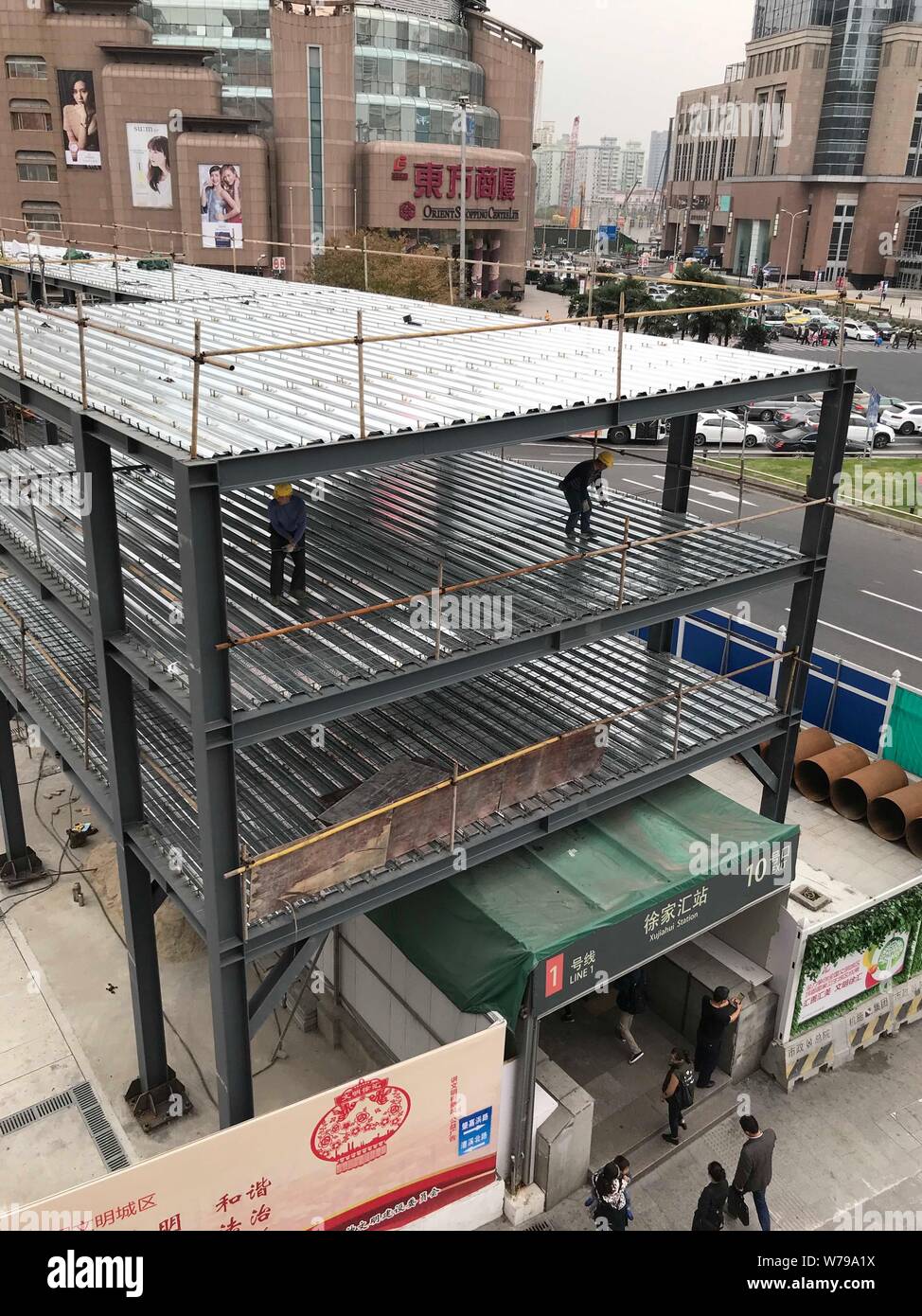A ring-shaped pedestrian skywalk to connect malls is under construction ...