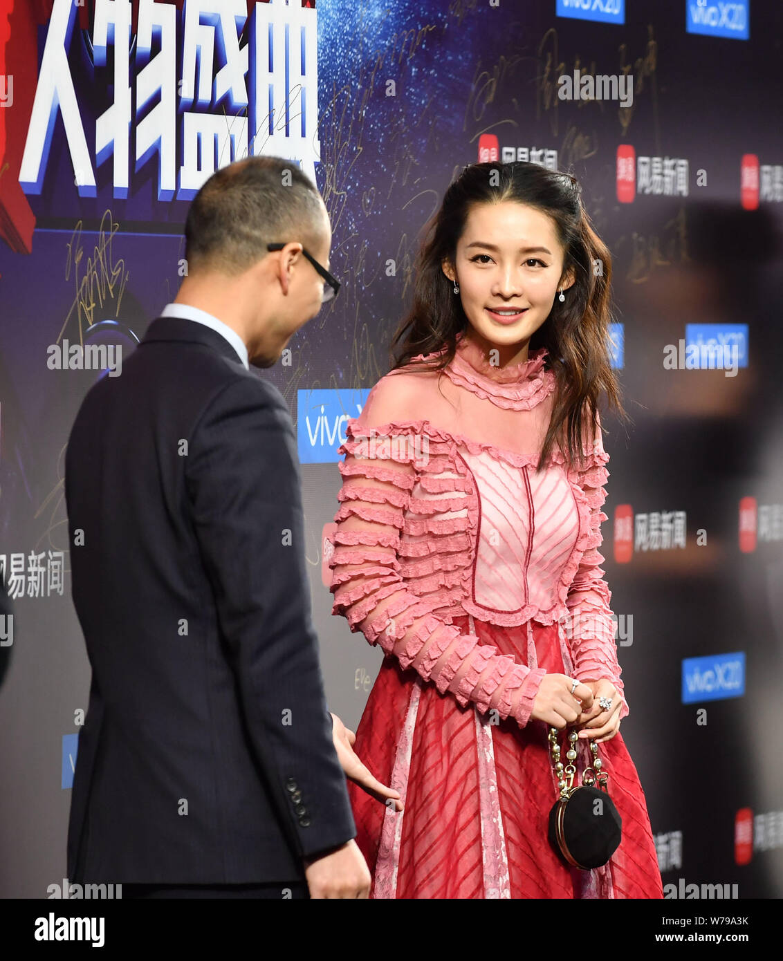 Chinese actress Li Qin, right, poses backstage during the 2017 NetEase ...