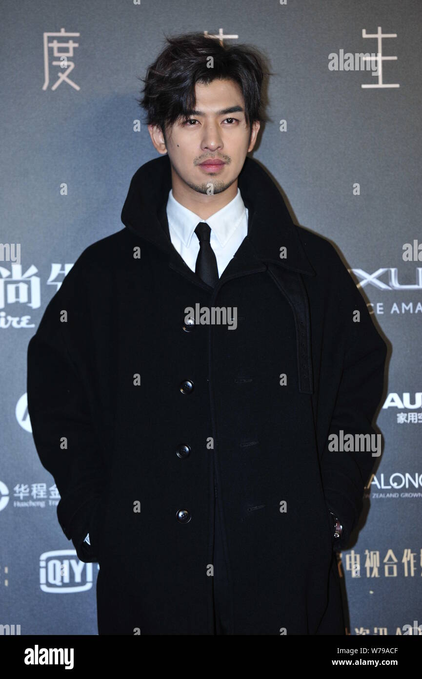Taiwanese actor Chen Bolin poses as he arrives on the red carpet for ...