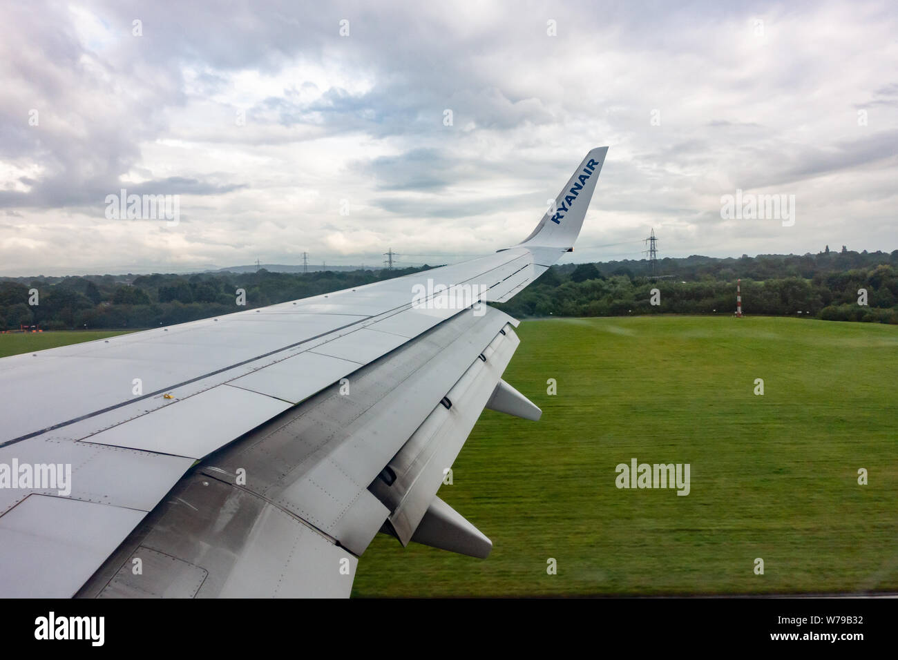 Wing brake flaps prepare to open on a Ryanair Boeing 737 - 800 for a ...