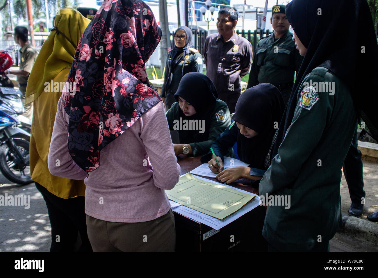 Resident women being given guidance on how to dress according to Sharia ...
