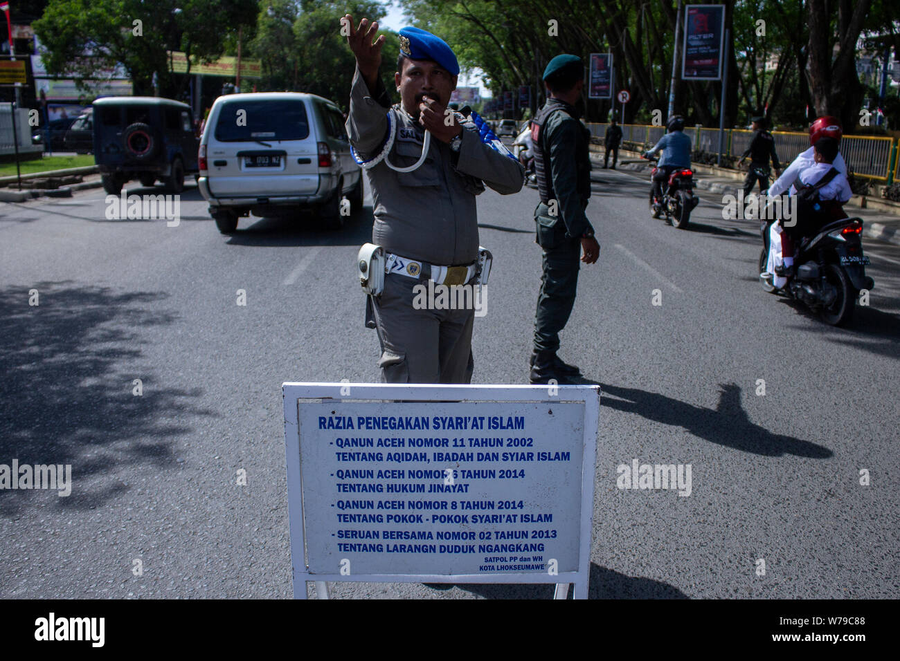 Islamic Sharia police regulate traffic during the enforcement.Dozens of ...