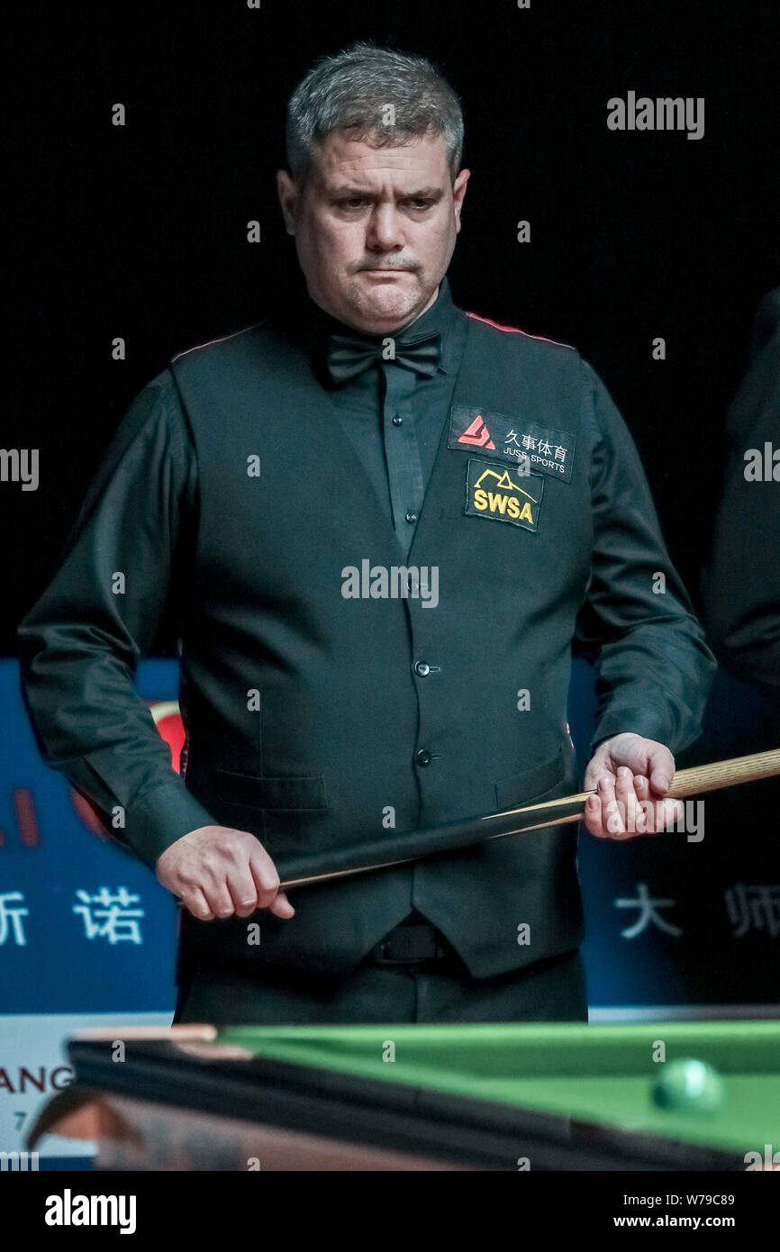 Robert Milkins of England considers a shot to Marco Fu of Hong Kong in ...