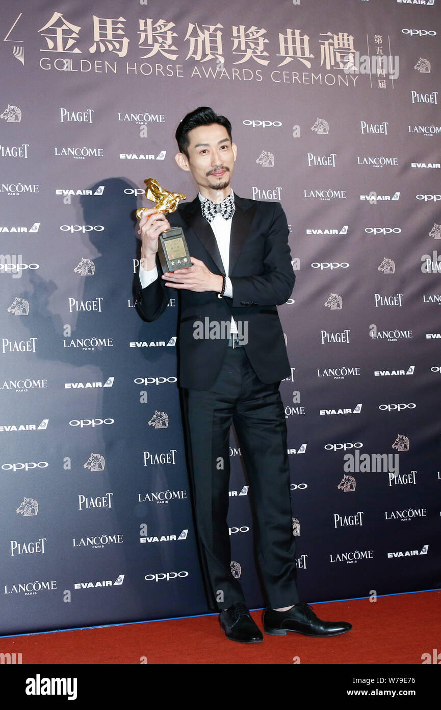 **TAIWAN OUT**Taiwanese actor Chen Chu-sheng poses with his trophy of ...