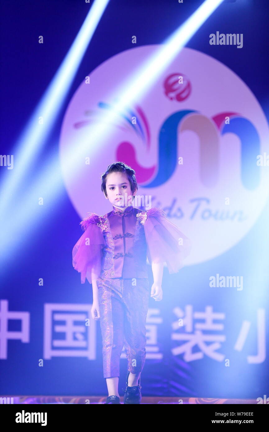 A child model displays a creation at a children model contest in Jimo ...