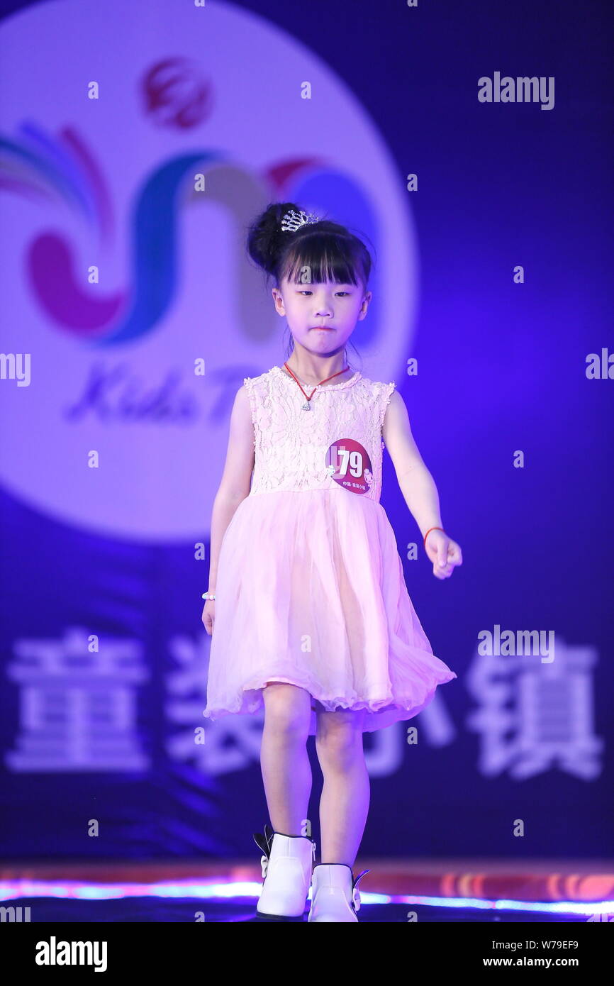 A child model displays a creation at a children model contest in Jimo ...