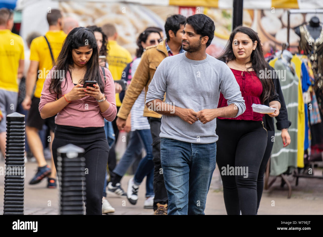 Cambridge, UK, August 1, 2019. International couple Having Conversation ...