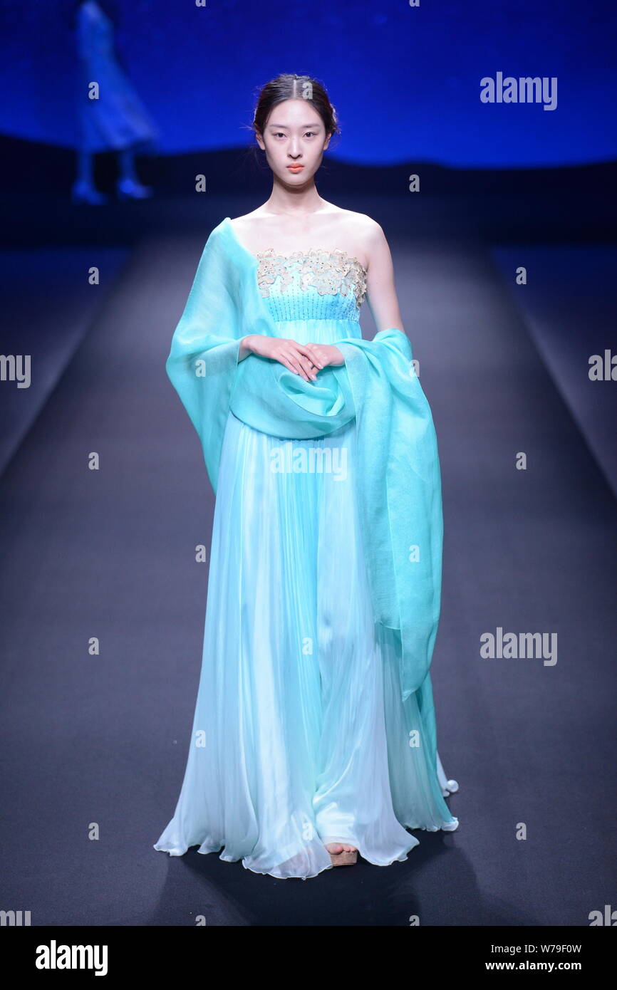 A model displays a new creation at the fashion show of Chuhetingxiang ...
