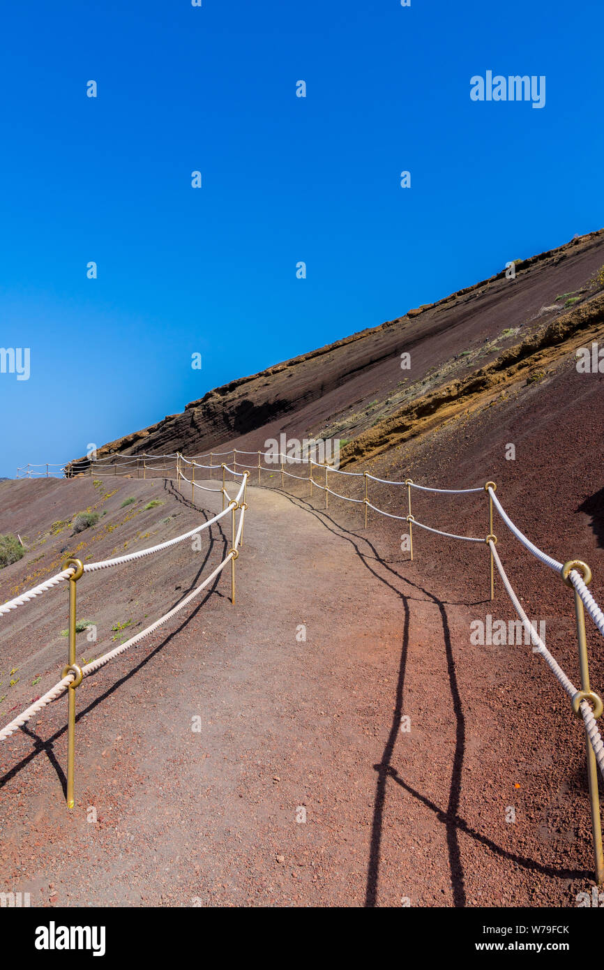 Path alongside red volcanic soil and nature landscape Stock Photo - Alamy