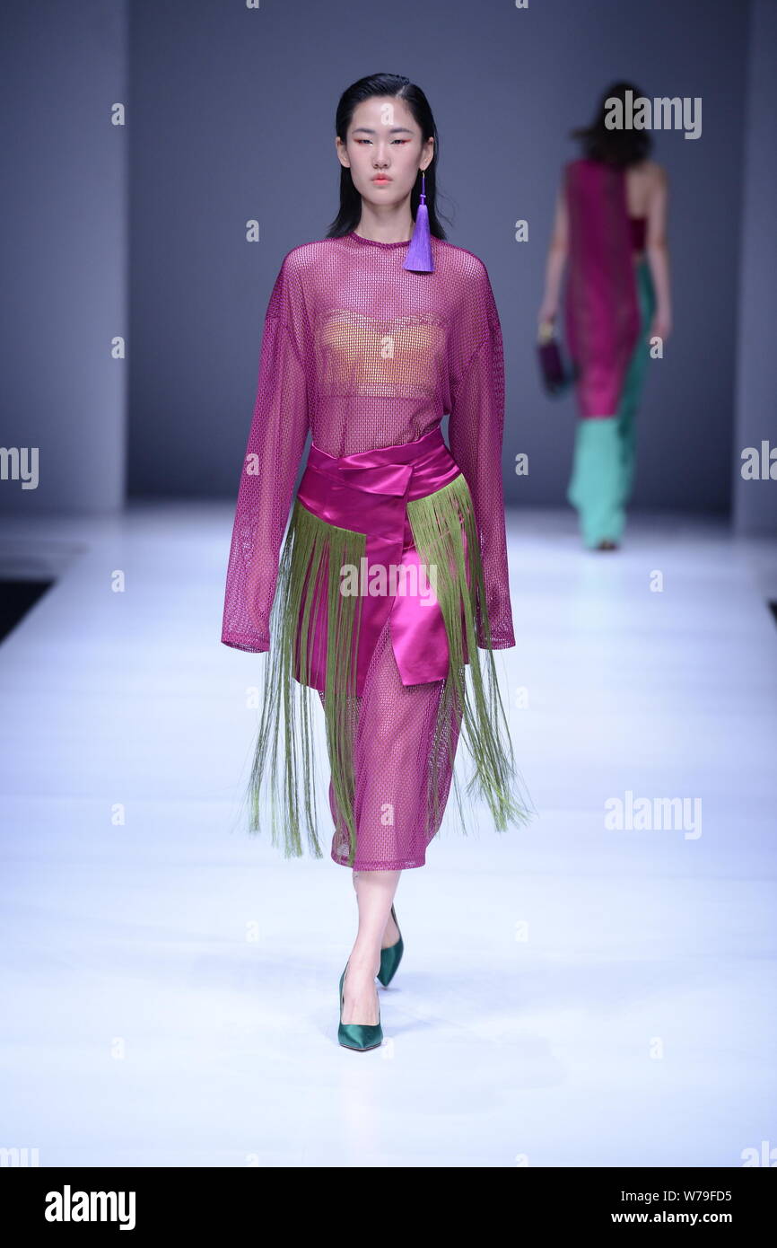 A model displays a new creation at the fashion show of Y'S mono by Liang Yan during the China ...