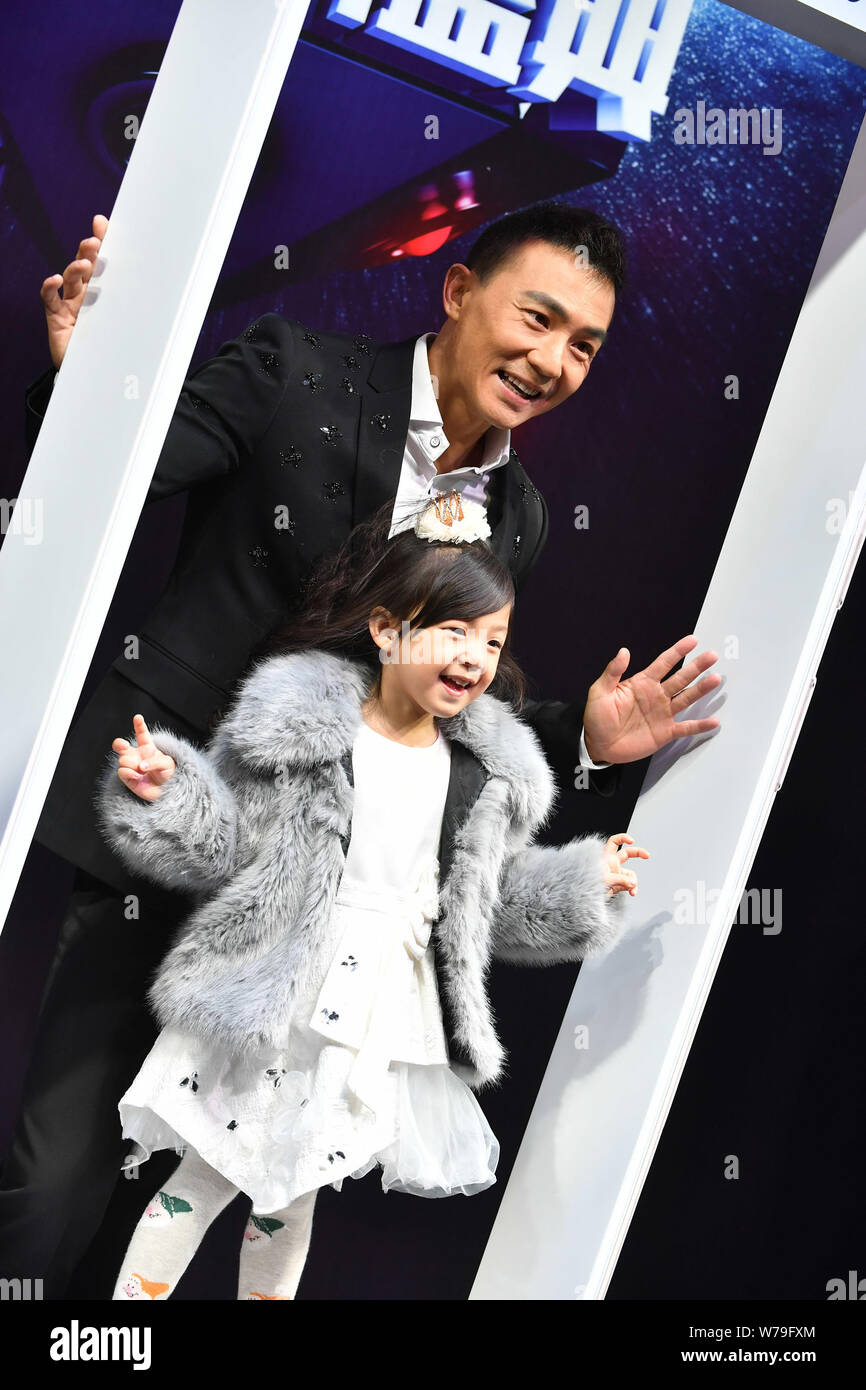 Taiwanese singer and actor Will Liu and his daughter Eve are pictured ...