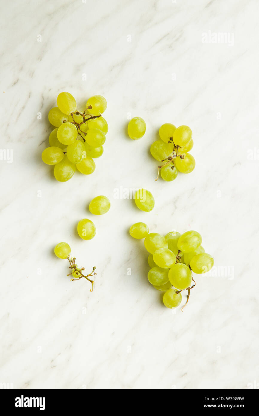 Tasty green grapes. White grape on white table. Top view Stock Photo ...