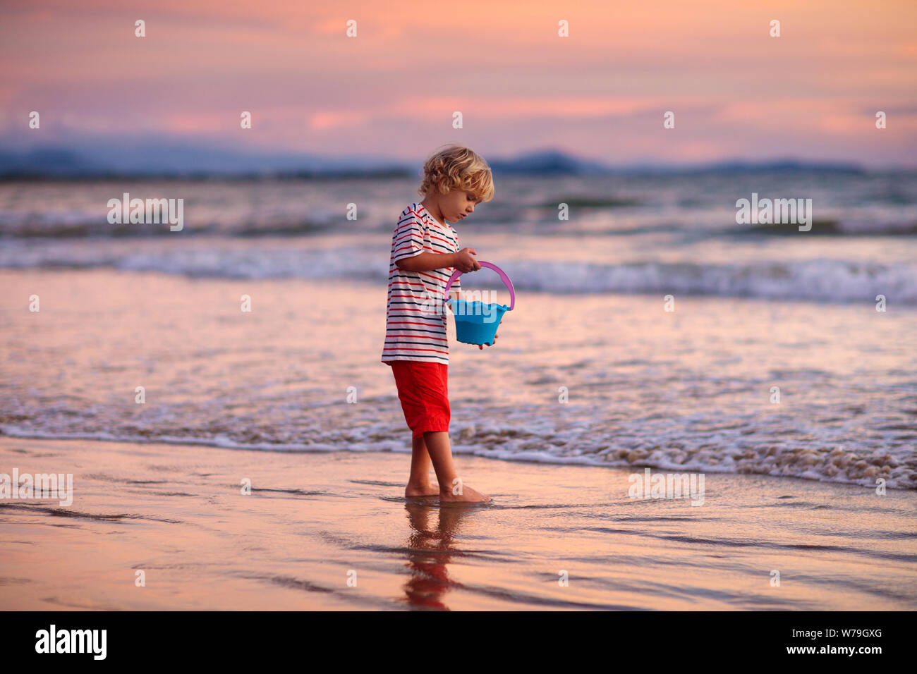Child Playing In The Waves High Resolution Stock Photography and Images ...