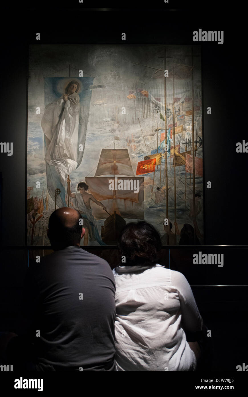 Family watching at the canvas by S. Dali "The discovery of America by ...