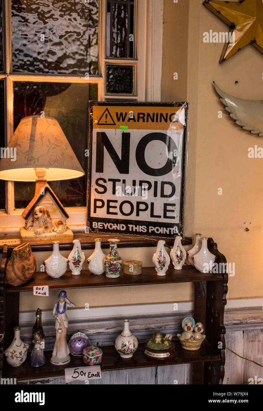 Warning notice in shop Stock Photo - Alamy
