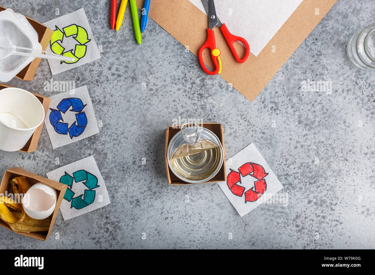 Kids hands is making recycling game kid is drawing recycle sign paper ...
