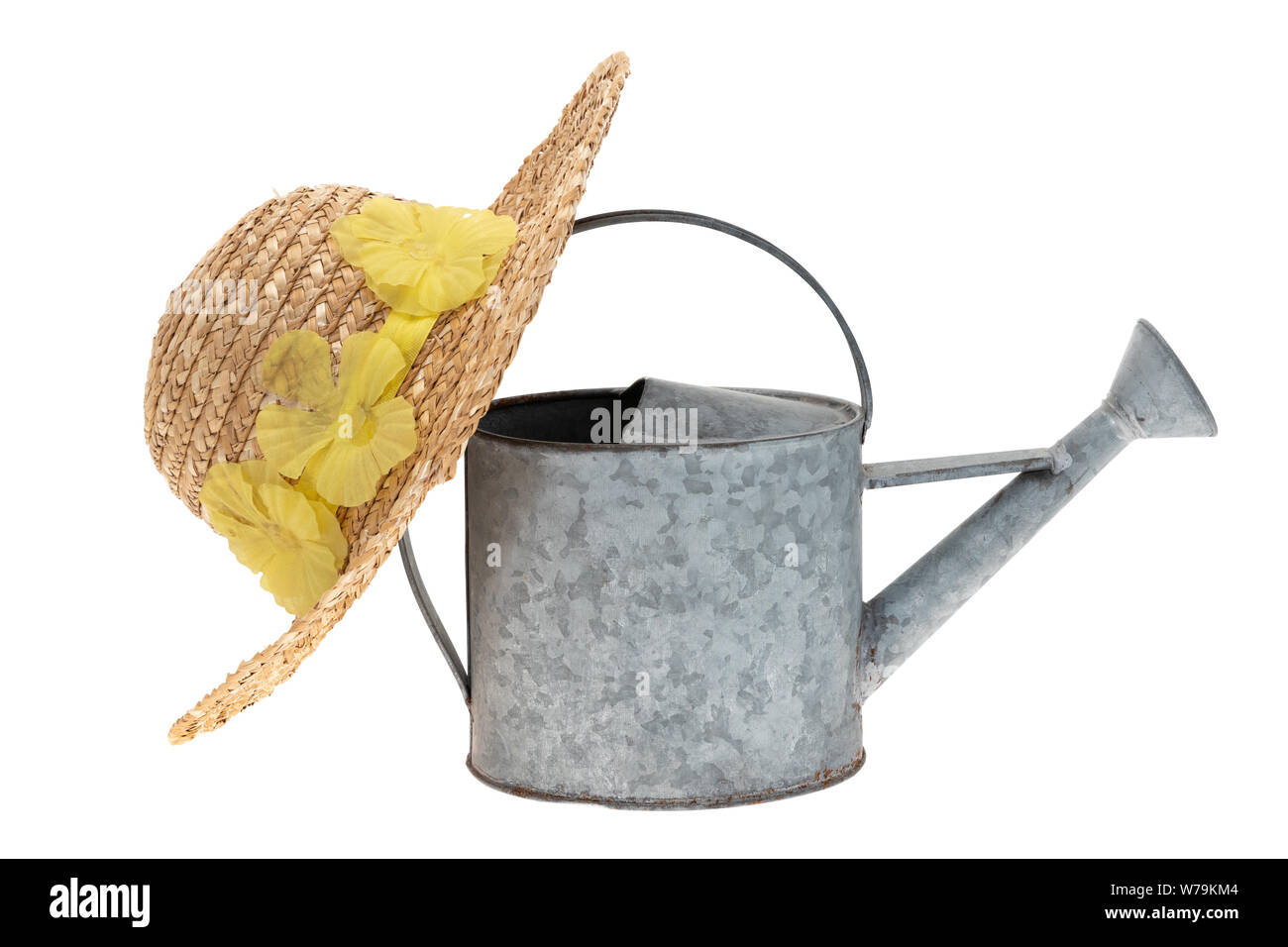 Watering can and straw hat - white background Stock Photo - Alamy