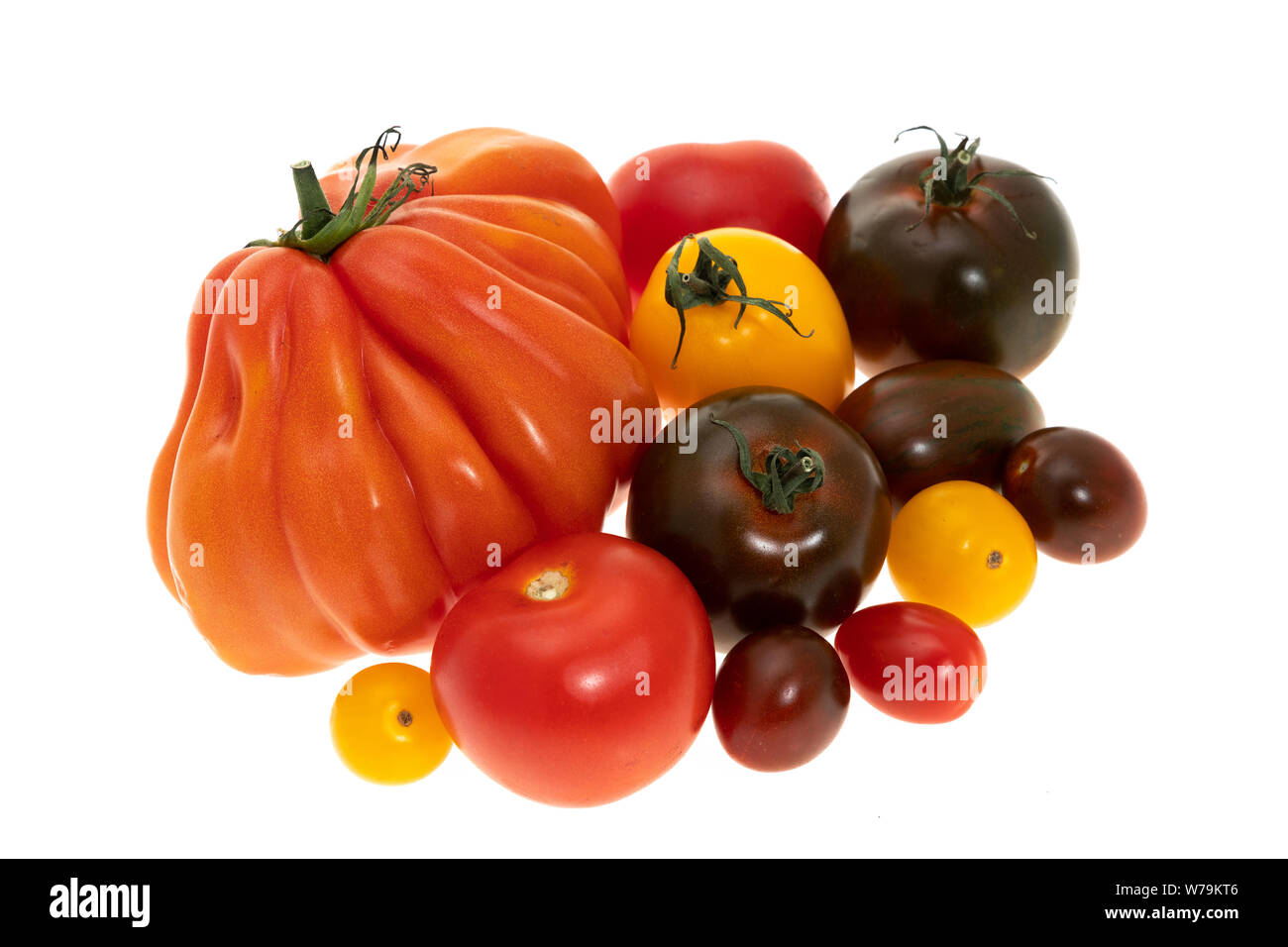 Various tomato varieties - white background Stock Photo - Alamy