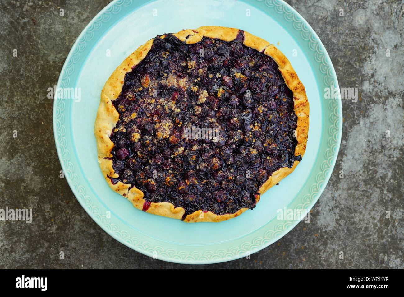 Homemade rustic galette pastry with fresh blueberries and ground ...
