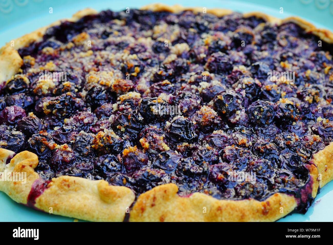 Homemade rustic galette pastry with fresh blueberries and ground ...