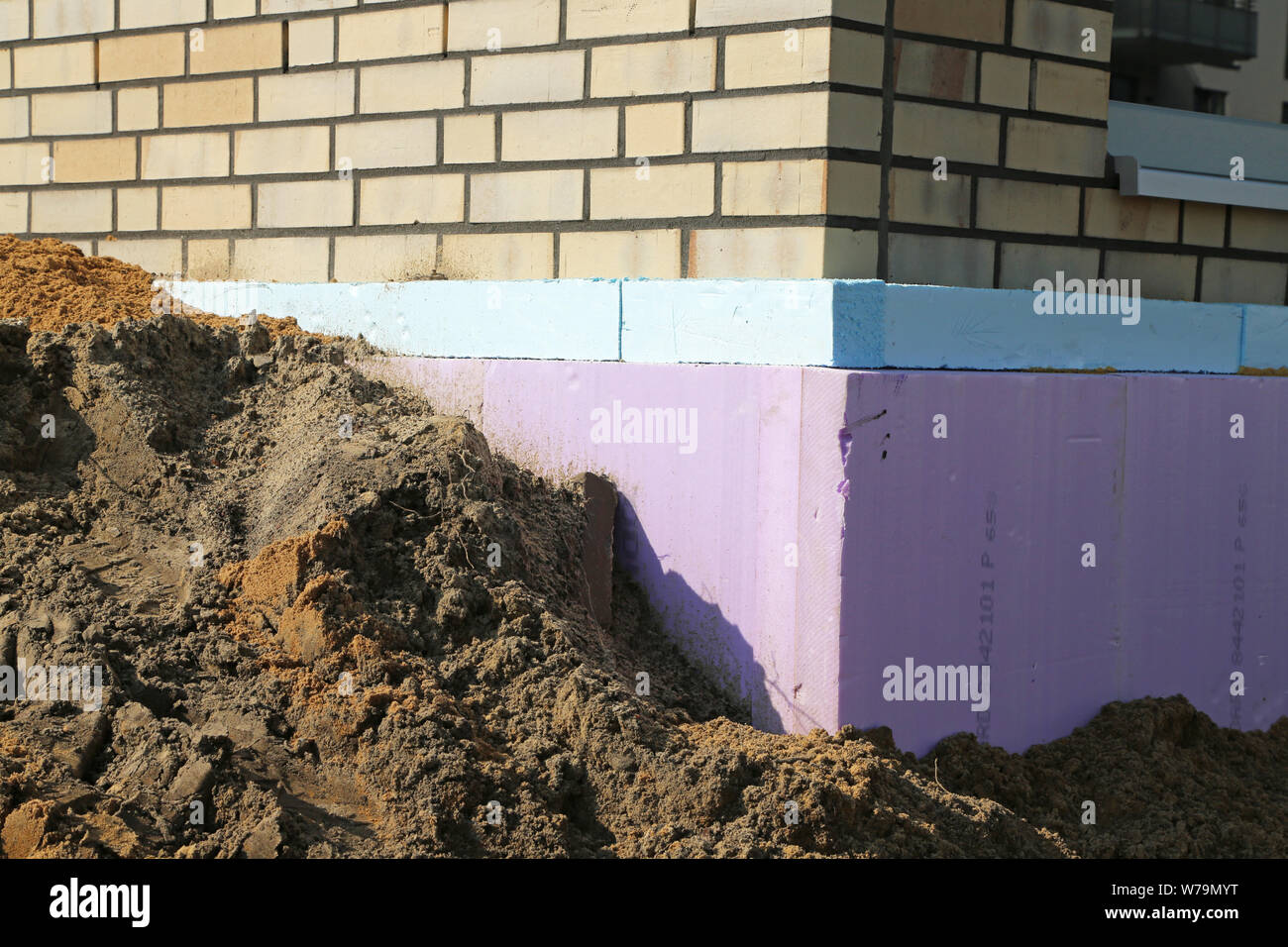 purple perimeter insulation under brick wall Stock Photo - Alamy