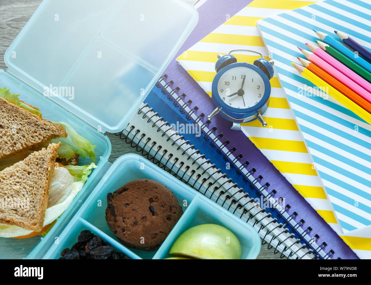 School blue lunch box with homemade sandwich, green apple, cookies ...