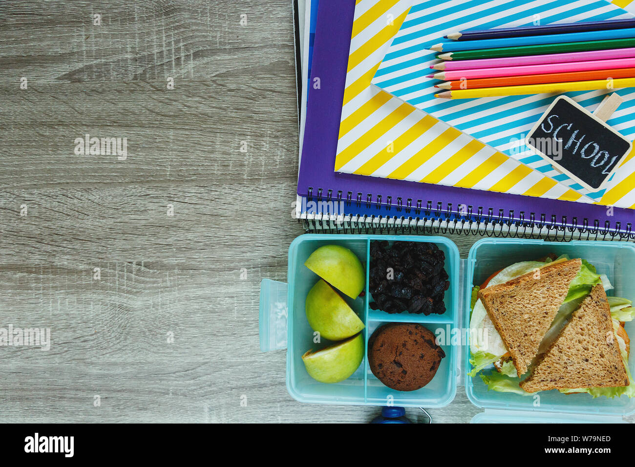 School blue lunch box with homemade sandwich, green apple, cookies ...