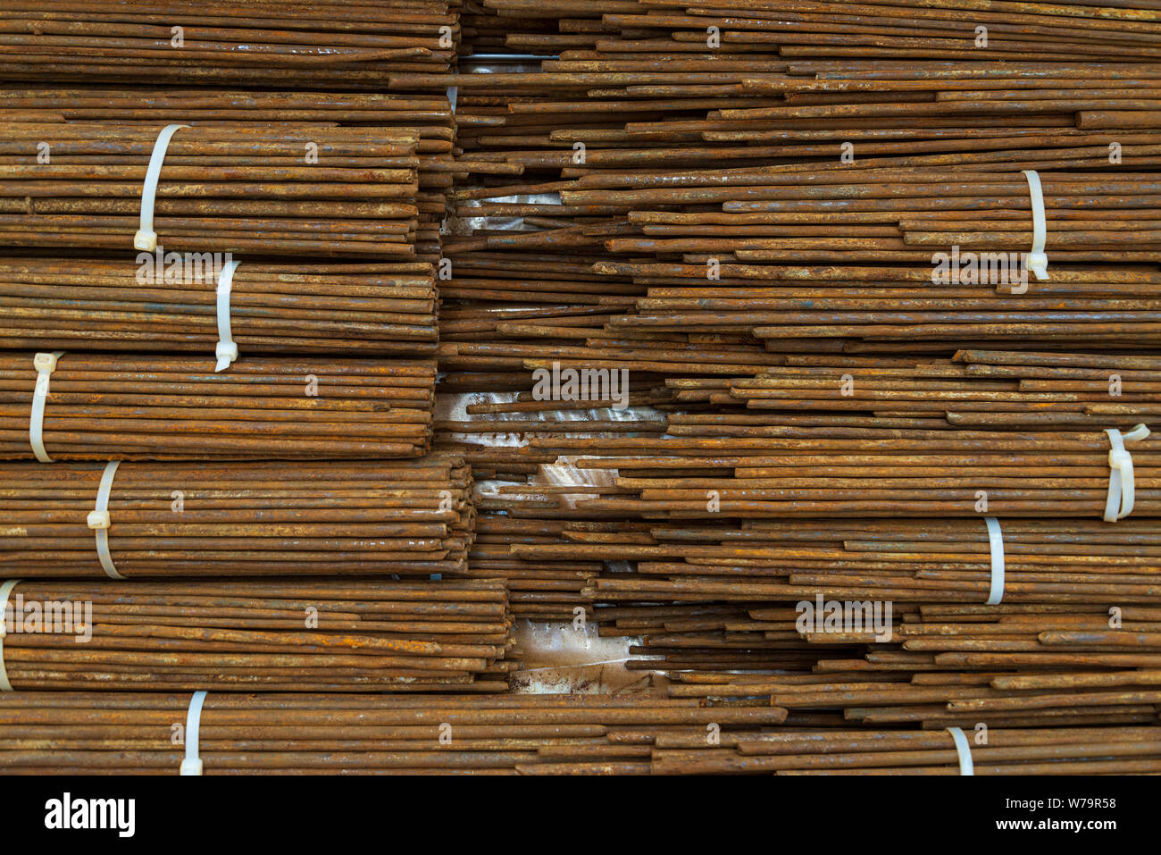 Top horizontal view close up stack of straight old rusty high yield ...