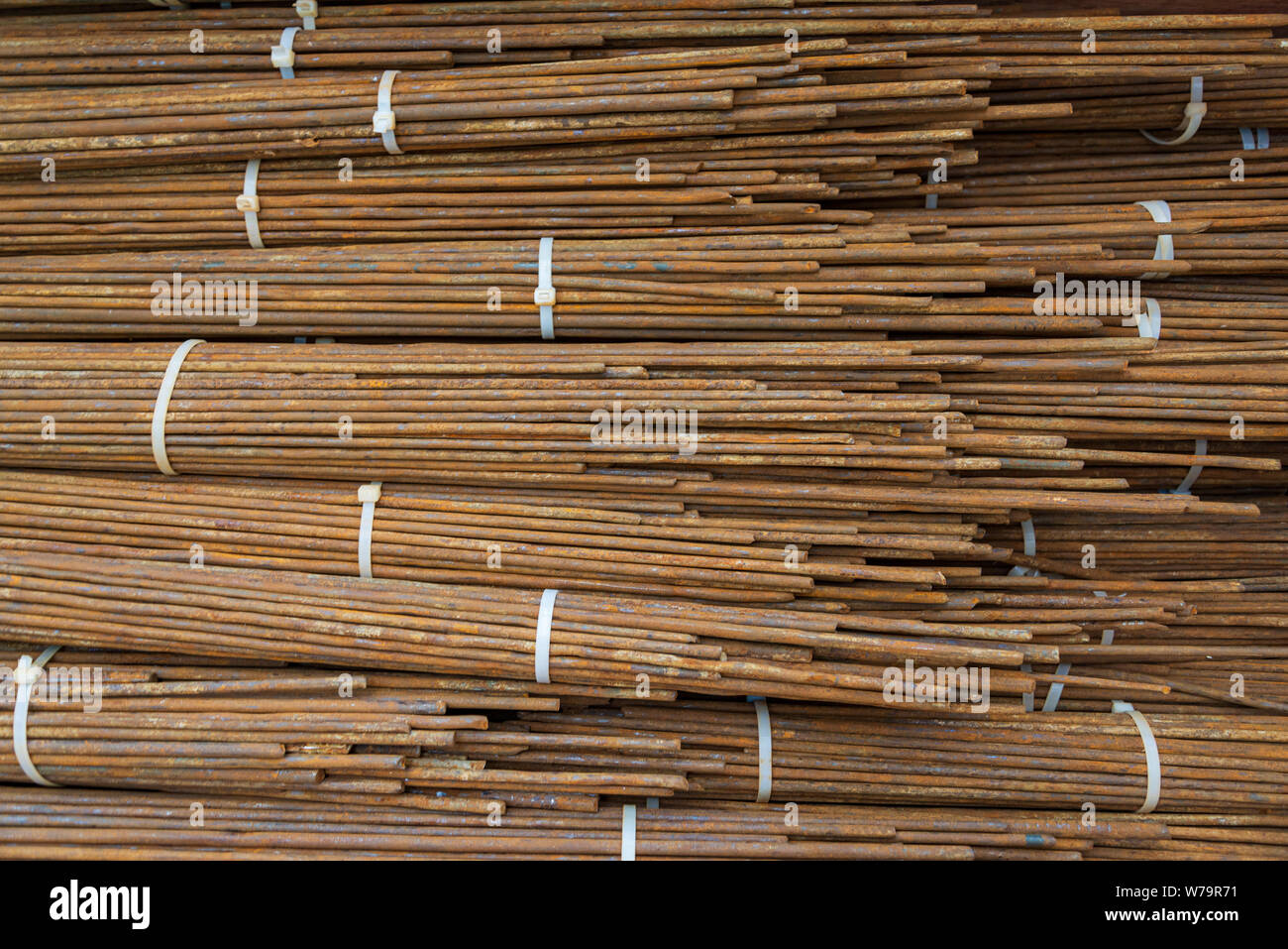 Top horizontal view close up stack of straight old rusty high yield ...