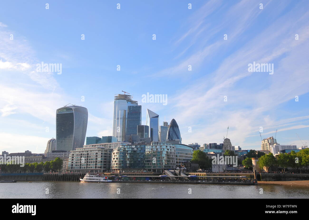 Downtown office buildings along Thames river cityscape London England ...