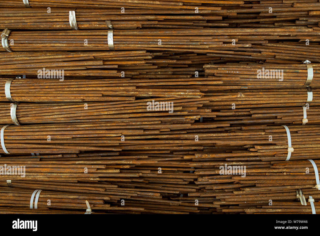 Top horizontal view close up stack of straight old rusty high yield ...