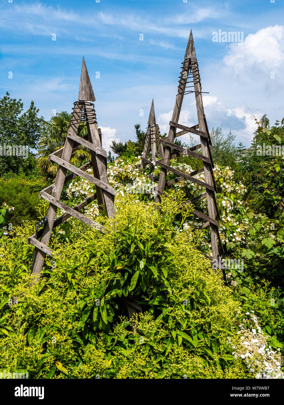 Stylish wooden pyramidal plant supports at Bristol Botanic Gardens UK ...