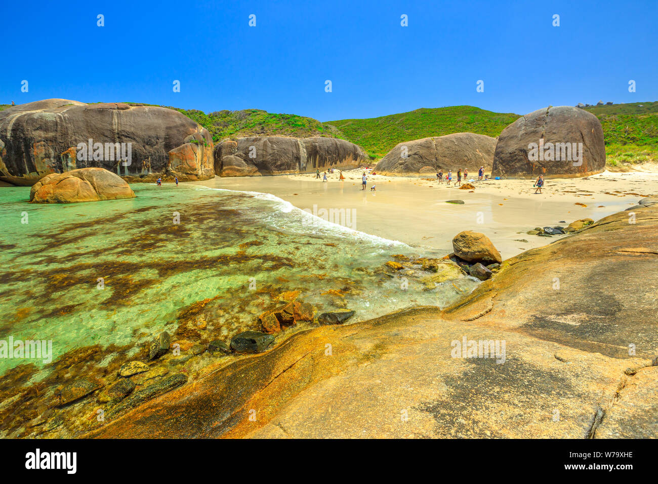 A view across Elephant Cove from eastern side of bay. People walking on ...
