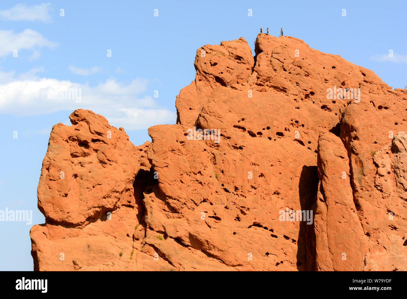 people climb to the top of a huge rock summit, successful people ...