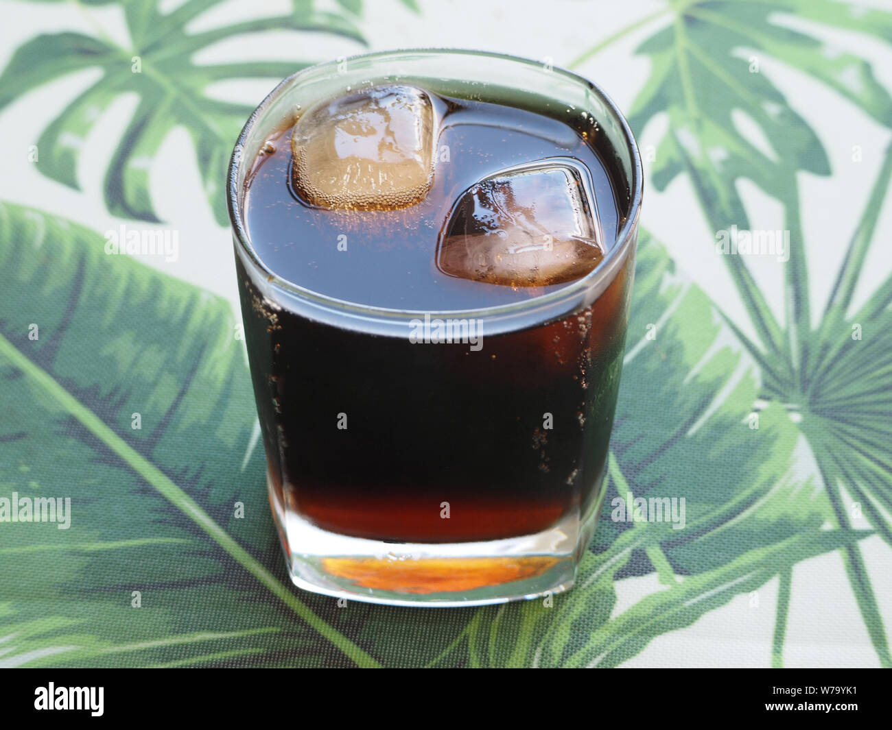 A glass of cola with ice Stock Photo - Alamy