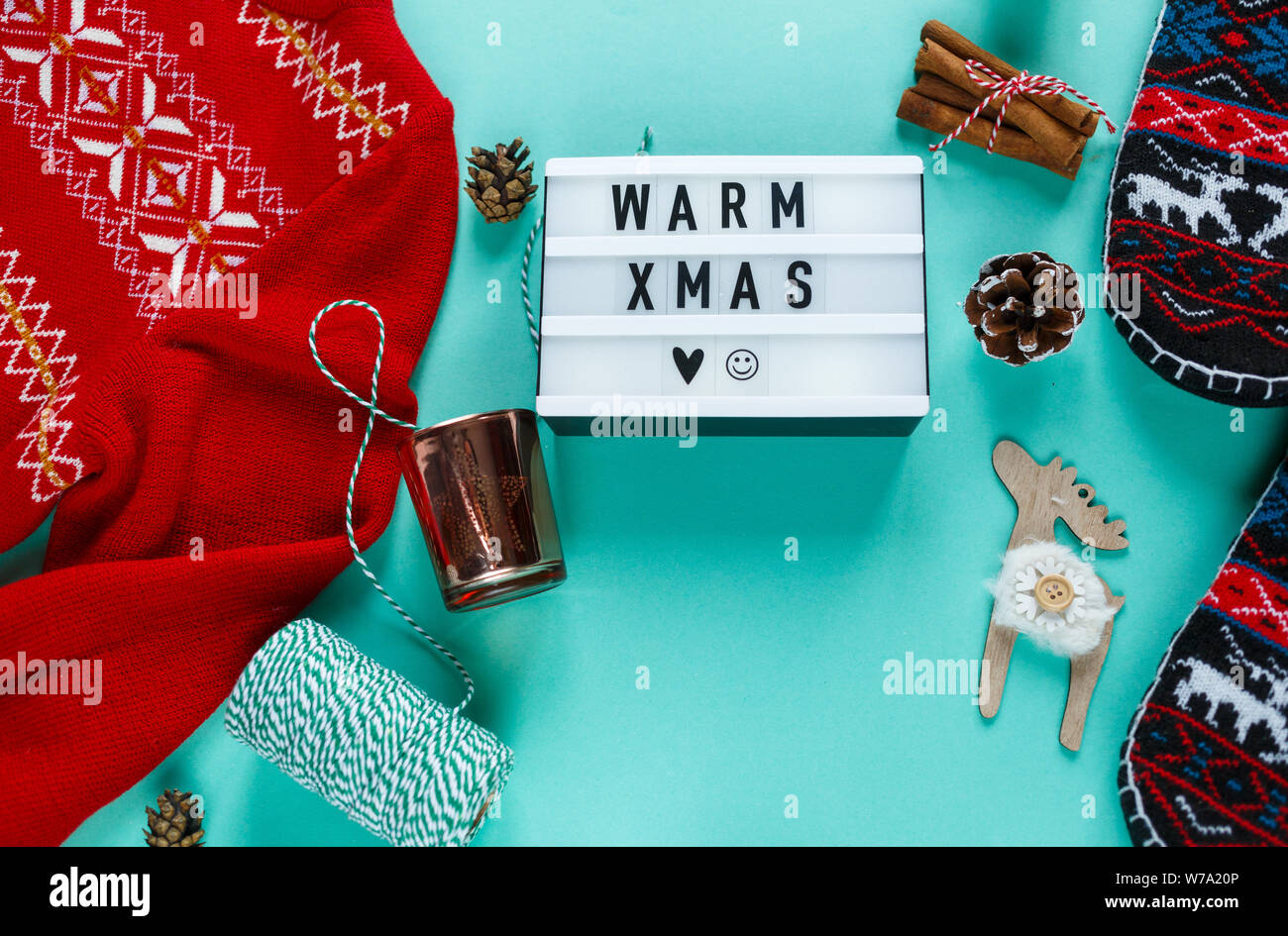 Christmas concept flat lay. Warm, cozy winter clothing and Christmas ...