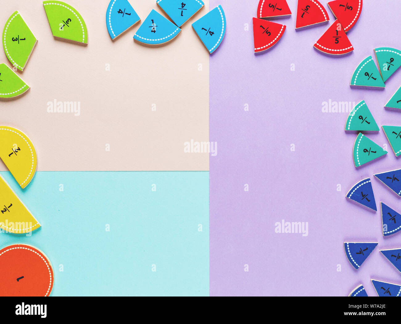 Colorful math fractions and wooden abacus on the pink blue violet ...