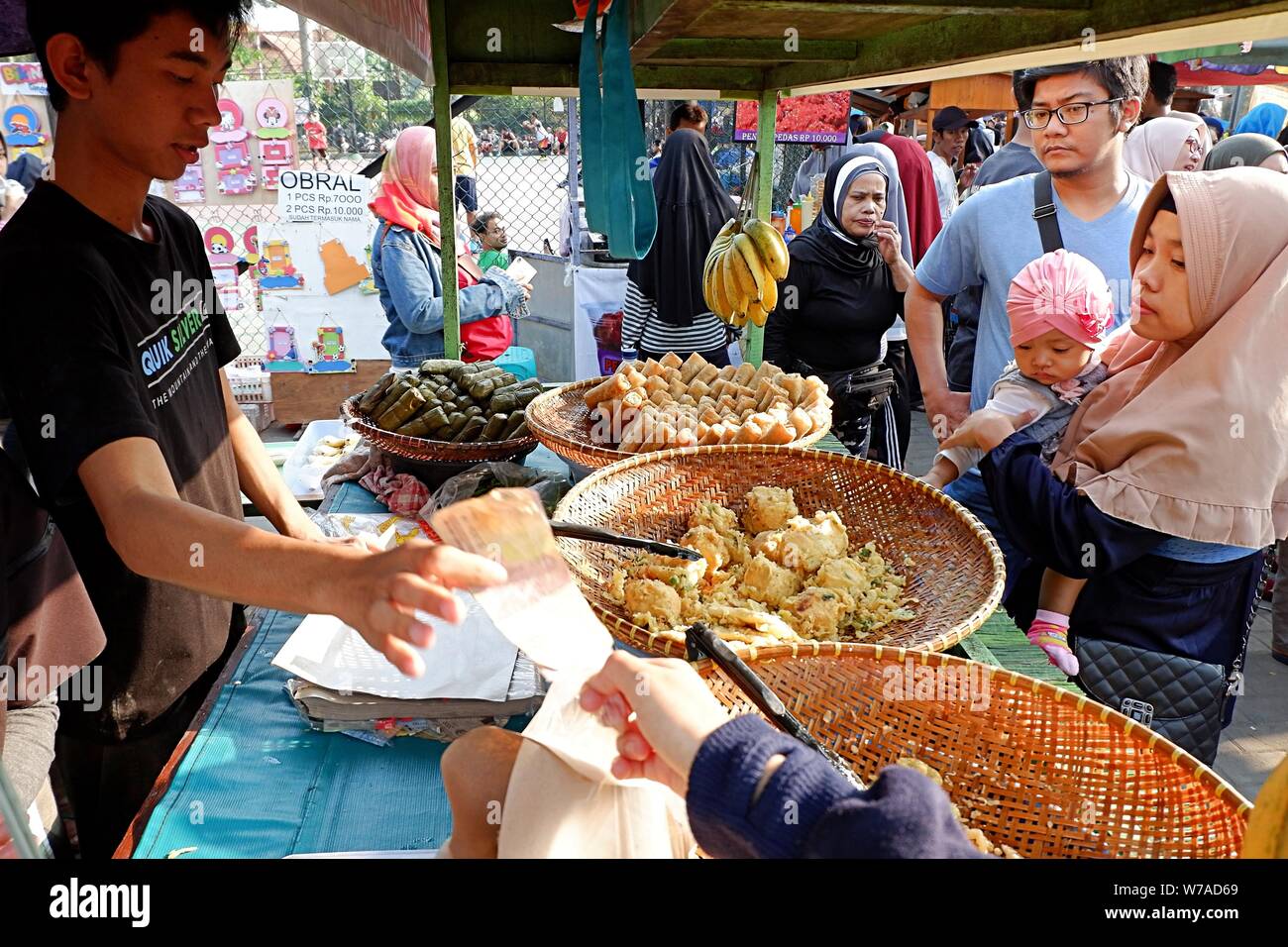 A view of seller and buyer in a street food booth Stock Photo - Alamy