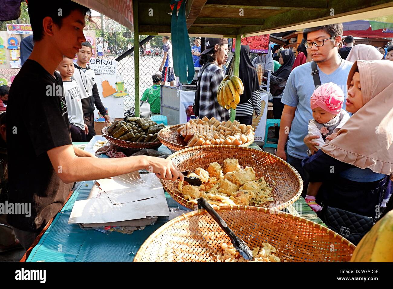 A view of seller and buyer in a street food booth Stock Photo - Alamy