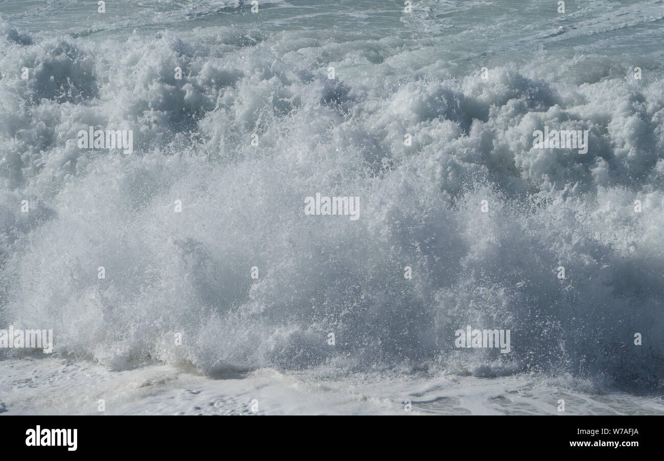 Closeup of ocean Waves, Foamy white water from a wave breaking and ...